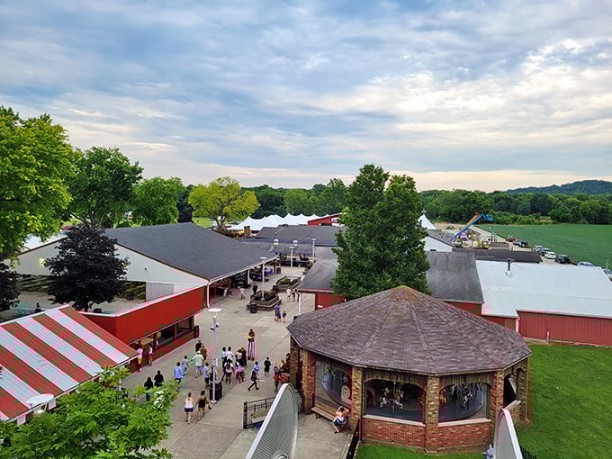 The classic Scrambler ride spins against a backdrop of wooden coaster tracks &ndash; a perfect snapshot of old-school amusement park magic that never goes out of style.