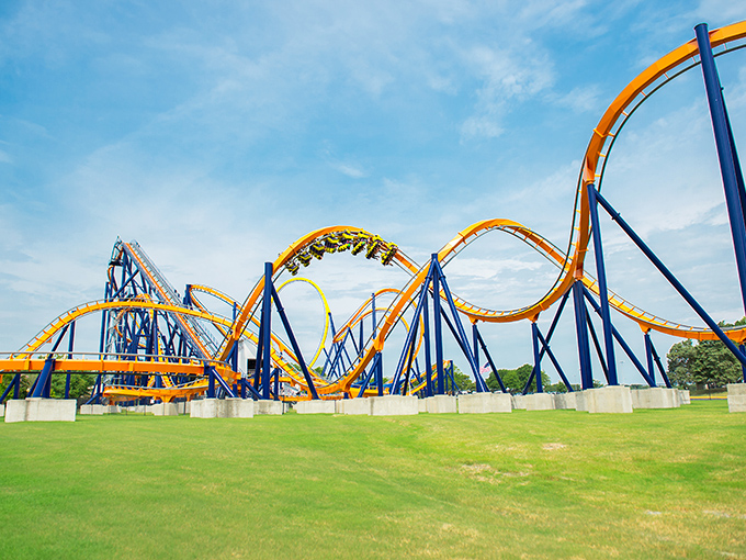 Dominator's orange and blue tracks twist like a metal pretzel gone wild. Proof that engineers have a wicked sense of humor when designing your afternoon adrenaline fix.