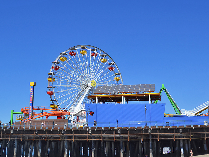 The ultimate California dream: a vibrant amusement park perched over the Pacific Ocean, where cotton candy dreams and salty breezes create perfect seaside memories.