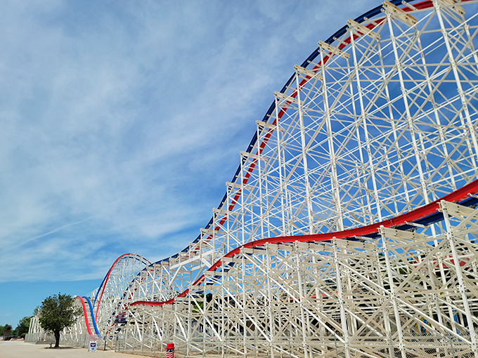 ArieForce One's patriotic red, white, and blue tracks climb skyward – a magnificent wooden coaster promising both nostalgia and thrills.