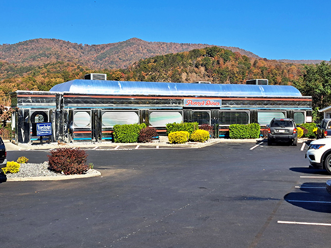 Like a chrome time machine nestled against Virginia's autumn mountains, Penny's Diner's gleaming exterior promises nostalgic delights within. Pure roadside Americana at its finest.