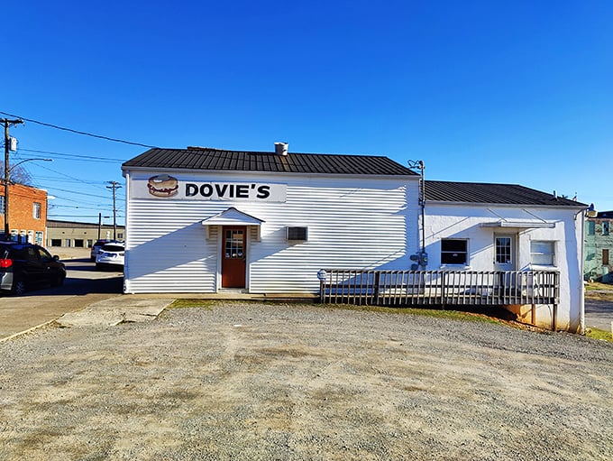 The unassuming white exterior of Dovie's stands like a culinary lighthouse in Tompkinsville, beckoning burger pilgrims from across Kentucky's rolling hills.