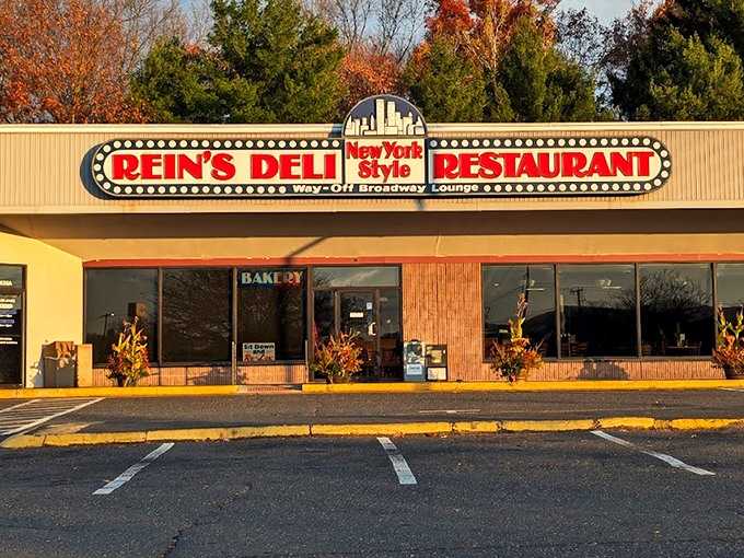 The iconic yellow exterior of Rein's Deli stands like a beacon of hope for hungry travelers on I-84, promising New York deli salvation in Connecticut.