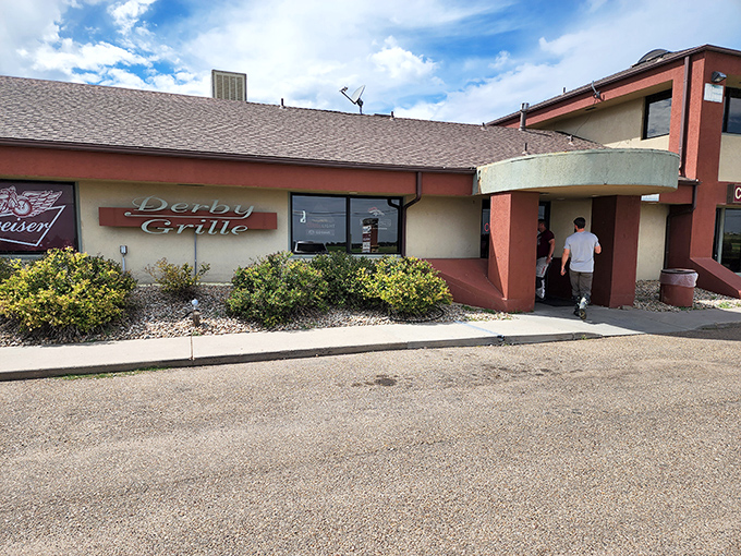 The Derby Grille stands ready for hungry visitors, with motorcycles lined up outside like dinner guests who couldn't wait to get a table. 