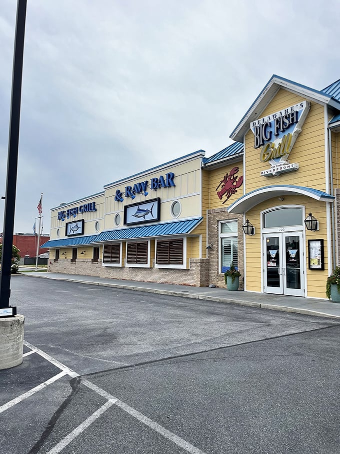 The cheerful yellow exterior of Big Fish Grill stands like a beacon for seafood lovers, promising maritime delights within its nautical-themed walls.