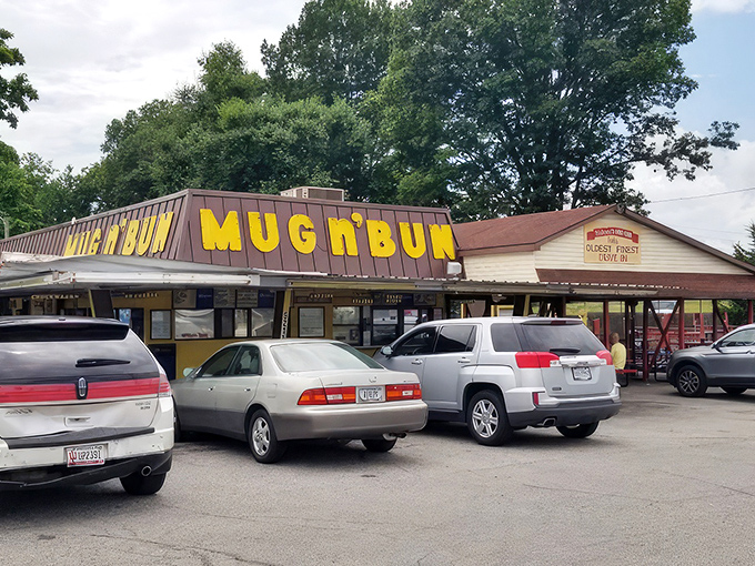 The bright yellow "MUG n BUN" sign stands as a beacon of hope for burger lovers who know that sometimes the best meals come from the most unassuming places.