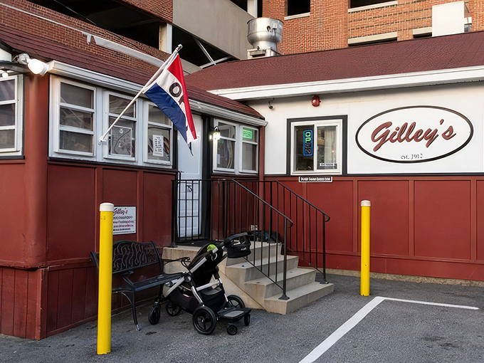 Gilley's stands proudly against Portsmouth's modern backdrop, a time-traveling red lunch car that refuses to be overshadowed by the parking garage behind it.