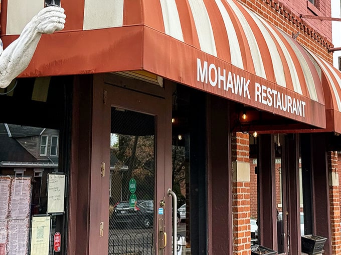 The iconic red and white striped awning of The Old Mohawk beckons like a culinary lighthouse in Columbus's charming German Village. Resistance is futile.