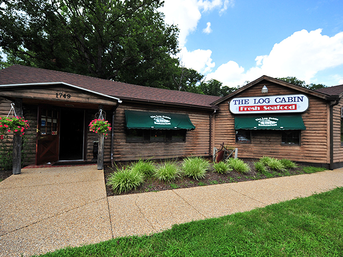 The rustic exterior of The Log Cabin isn't just charming&mdash;it's a promise that what awaits inside is authentic, unpretentious, and deliciously memorable.