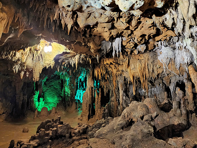 The cave's vibrant lighting transforms ancient limestone into nature's own psychedelic light show. Mother Nature's been decorating for millions of years, and it shows.