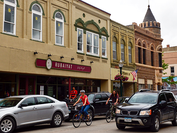 Downtown Decorah welcomes cyclists with historic charm and modern amenities. The beautifully preserved buildings house local treasures like Rubaiyat restaurant.