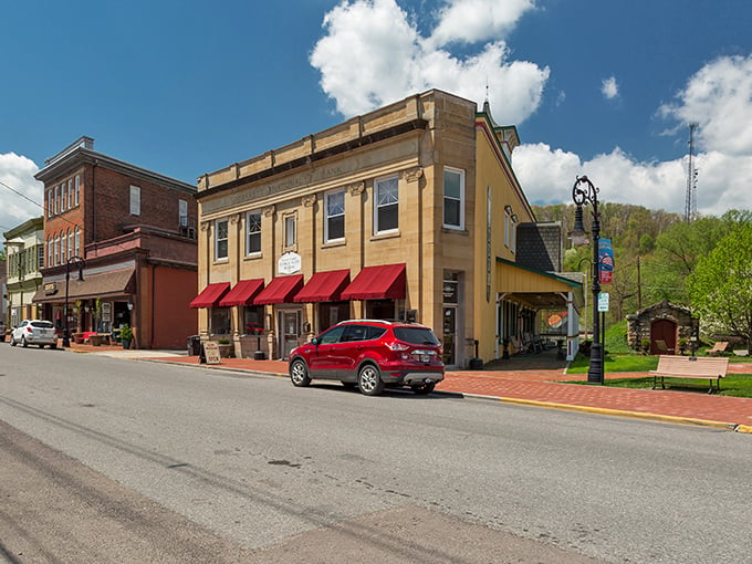 Historic brick buildings with bright red awnings line Oakland's main street &ndash; small-town charm that's aged like a fine wine.