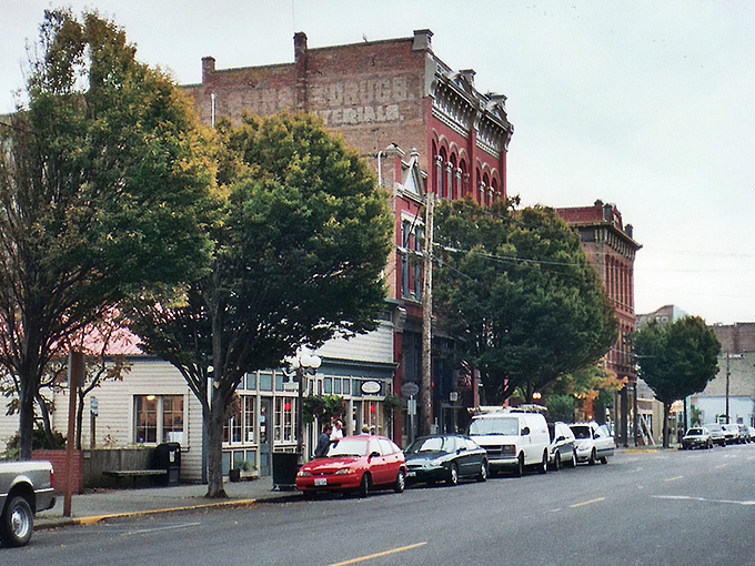 Victorian elegance meets Pacific Northwest charm on Water Street, where brick buildings whisper stories of maritime dreams and the almost-was "New York of the West."