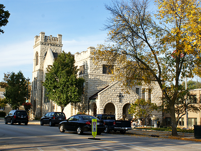 The limestone church stands like a medieval castle in autumn's golden embrace, a testament to Cedarburg's architectural heritage that stops first-time visitors in their tracks.