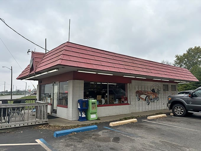 Welcome to time travel central! Rock-Cola's distinctive red roof and vintage car mural aren't just decoration&mdash;they're your first clue you've stumbled upon something special on Indy's east side.
