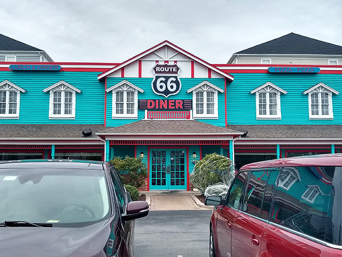 The turquoise beacon of Route 66 Diner stands out against the Maryland sky like a time portal to the 1950s, beckoning hungry travelers with its nostalgic charm.