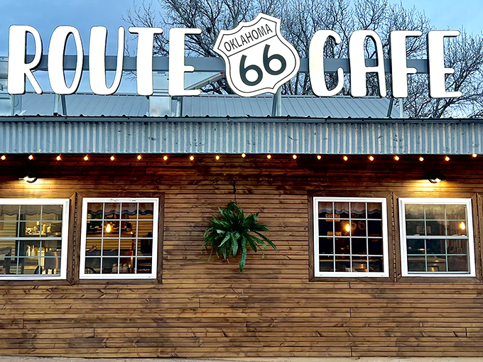 The weathered wooden exterior of Route 66 Cafe stands like a time capsule on Clinton's main drag, beckoning hungry travelers with promises of home cooking and nostalgia.