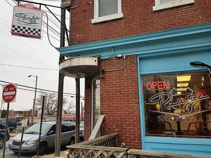 The unassuming brick entrance with its vibrant blue trim promises more than meets the eye—a perfect roadside discovery hiding in plain sight on Liberty Street.