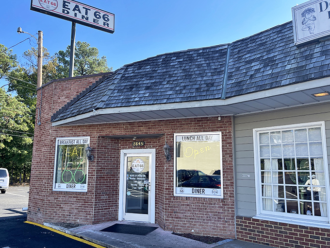 The brick facade of Eat 66 beckons like a time portal to simpler days, when "breakfast all day" was the sweetest promise a neon sign could make.