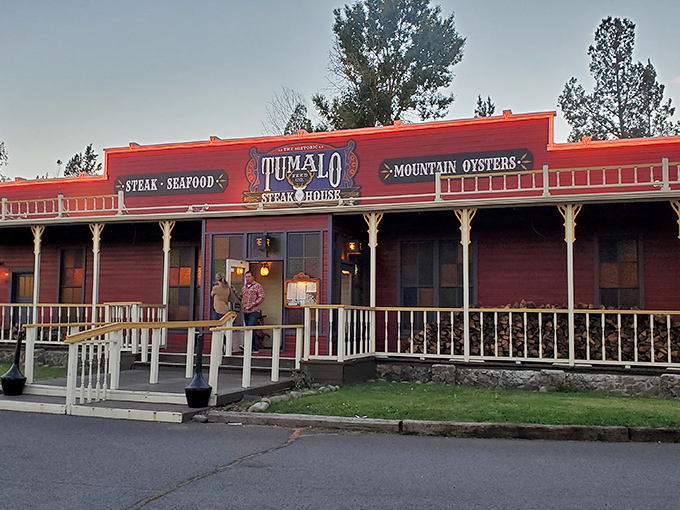 The iconic red exterior of Tumalo Feed Co. stands like a Western mirage against the Oregon sky, promising carnivorous delights within.
