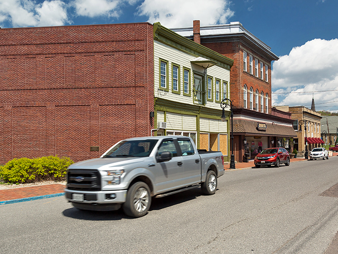 Historic brick buildings with bright red awnings line Oakland's main street &ndash; small-town charm that's aged like a fine wine.