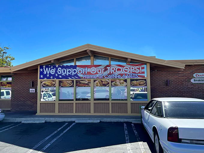 Patriotism meets pancakes at Crazy Otto's exterior. The "We Support Our TROOPS" banner reminds us that good diners are community cornerstones.