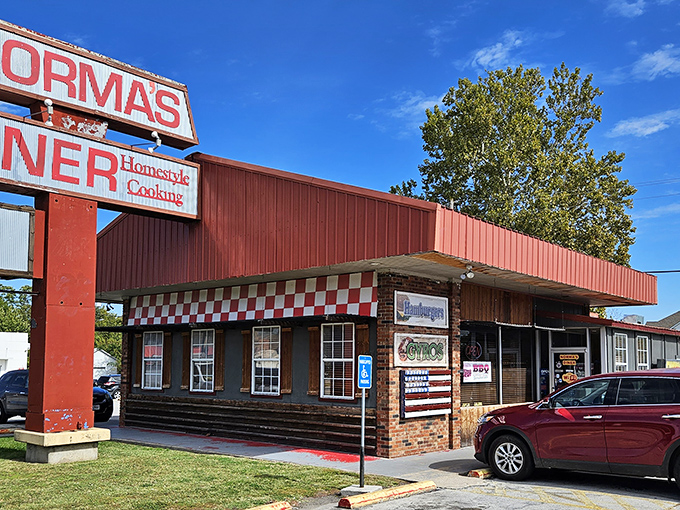 The iconic red exterior of Norma's Diner stands as a beacon of breakfast hope along Joplin's streets, promising homestyle cooking that's worth every mile of the journey.