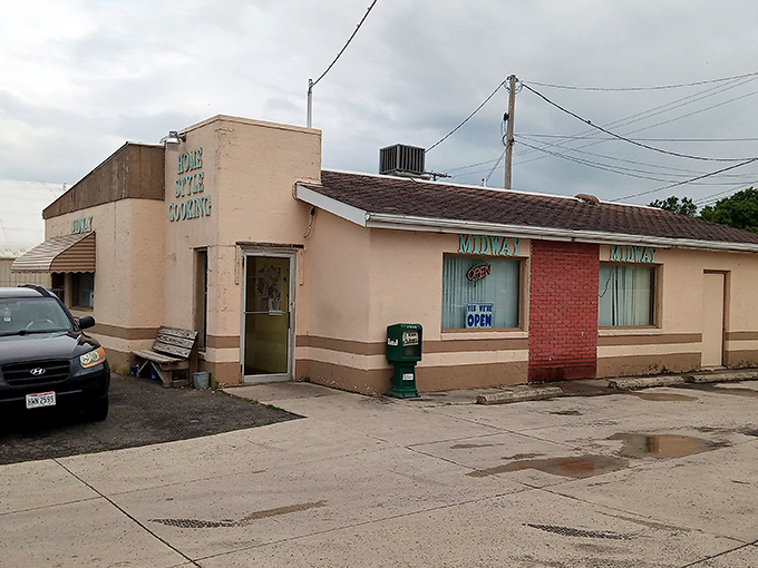 The unassuming exterior of Midway Restaurant stands as a beacon of breakfast hope in Kenton, where culinary magic happens behind that modest fa&ccedil;ade.
