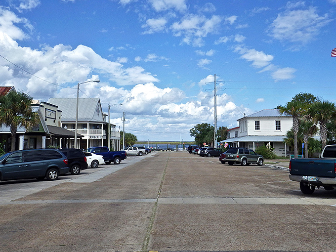 Downtown Apalachicola greets visitors with colorful bunting and historic brick buildings that whisper stories of Florida's maritime past.