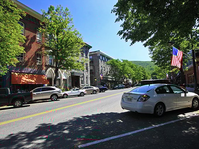 Historic brick buildings stand sentinel at Shelburne Falls' crossroads, where small-town charm meets architectural character that Norman Rockwell would have sketched with glee.
