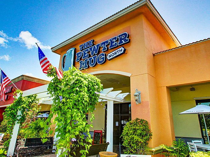 The Pewter Mug North stands proud against the Florida sky, American flags waving a patriotic welcome to hungry visitors.