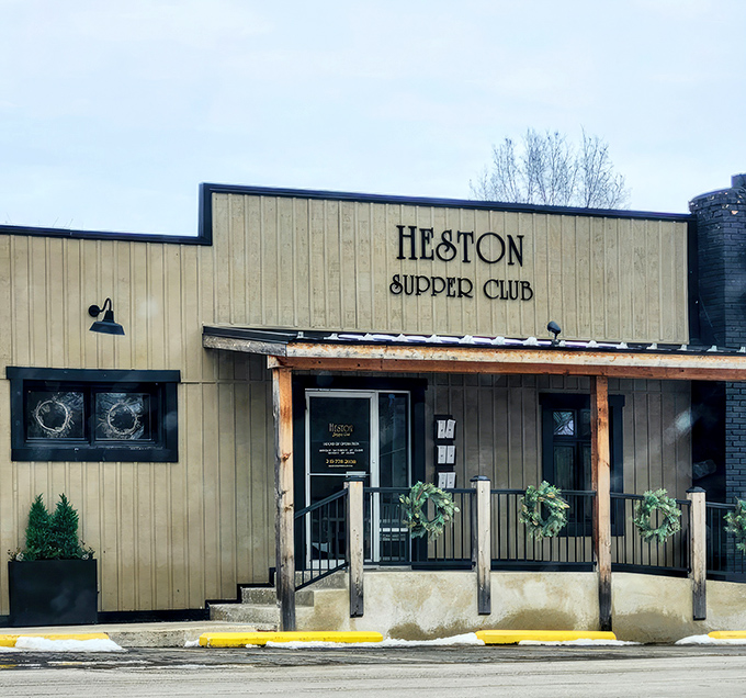 The unassuming tan exterior of Heston Supper Club stands like a culinary speakeasy, promising treasures for those who know to look beyond first impressions.