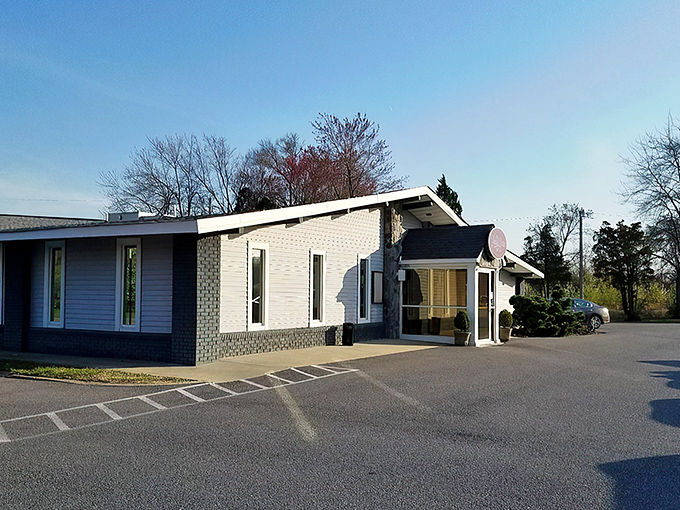 By day, The Prime Street Grille's purple sign stands as a modest beacon of culinary excellence in White Plains, promising steakhouse splendor behind its unassuming exterior.