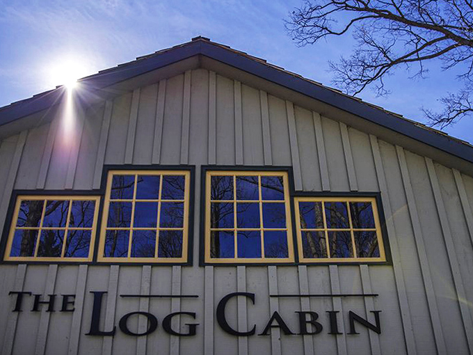 The Log Cabin's exterior glows with warm invitation at twilight, like a beacon of culinary promise in Pennsylvania's countryside.