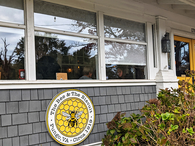The iconic yellow honeycomb logo welcomes hungry visitors like a beacon of breakfast hope. Those gray shingles hide culinary treasures that locals line up for every weekend.