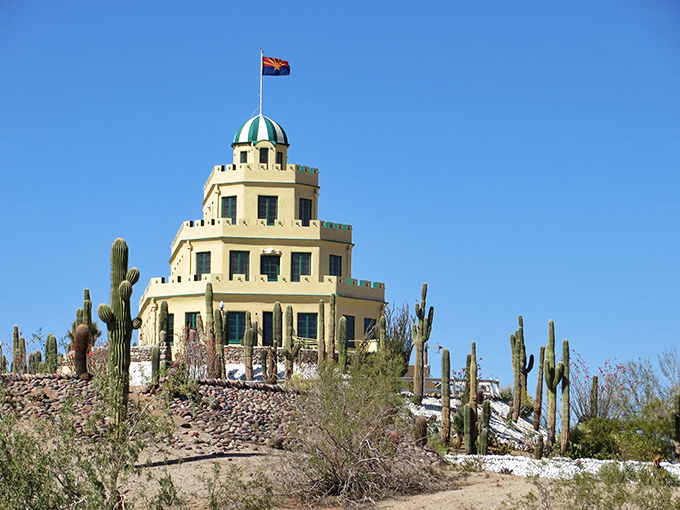 Like a wedding cake rising from the desert, Tovrea Castle stands proudly among thousands of cacti, a surreal vision under Arizona's impossibly blue sky.