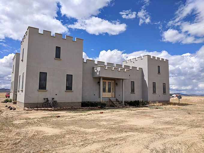 A medieval mirage rising from the Nevada desert, Paradise Ranch Castle stands defiantly against convention, its crenellated towers declaring "Yes, we built a castle in sagebrush country."