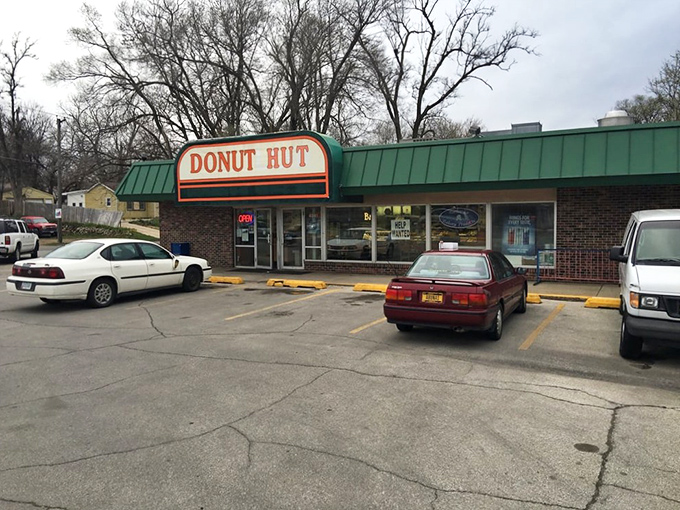 The green awning beckons like a sugar-coated lighthouse in a sea of ordinary breakfasts. Des Moines' morning pilgrimage spot doesn't need fancy signage when the donuts speak volumes.