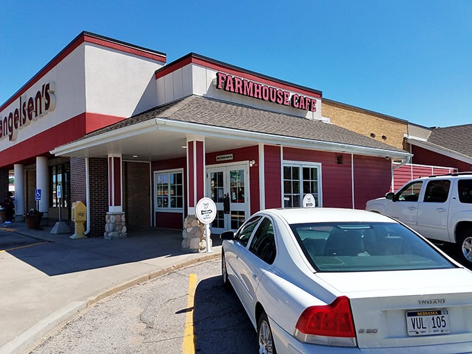 The iconic red exterior of FarmHouse Cafe beckons like a culinary lighthouse in Omaha's dining landscape. Comfort food paradise awaits!