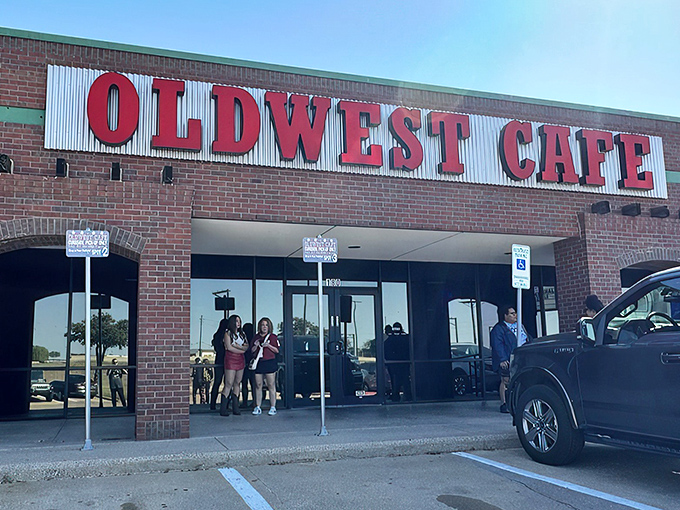 The bold red letters against corrugated metal announce Oldwest Cafe like a breakfast beacon. No fancy frills needed when what's inside speaks volumes.