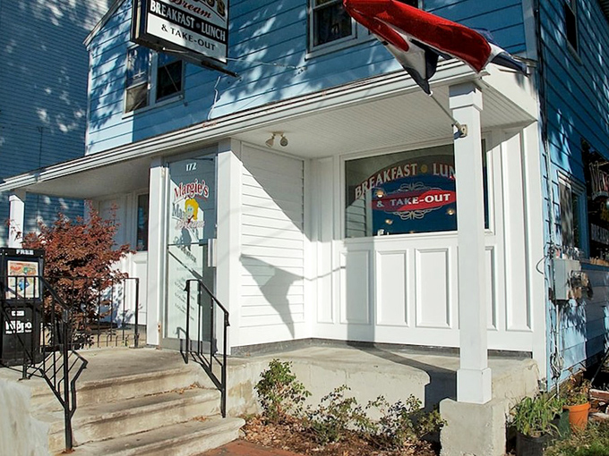 The iconic blue exterior of Margie's Dream Diner stands like a beacon of breakfast hope against the New Hampshire sky. Small building, big flavors.