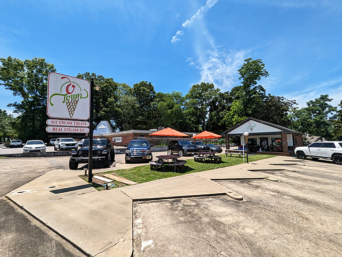 The classic ice cream parlor facade of O Town beckons like a sweet mirage on a hot Alabama day, complete with charming outdoor seating.