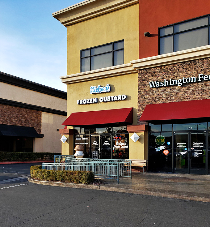Welcome to frozen custard nirvana! Nielsen's storefront beckons with retro charm and a giant ice cream cone sculpture that's practically winking at you.