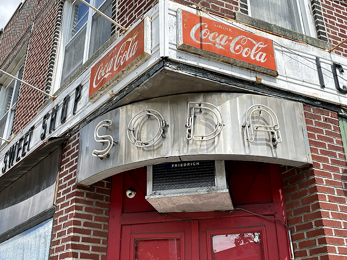 That classic red door and vintage "SODA" sign whisper promises of frozen happiness waiting inside.