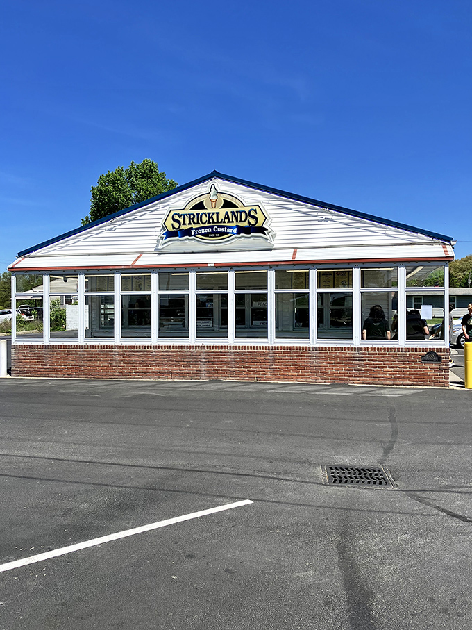 The white clapboard shrine to frozen happiness stands proudly in Akron, beckoning custard pilgrims from miles around with its classic Americana charm. 
