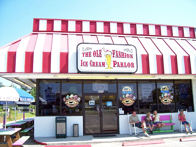 The red and white striped awning isn't just eye-catching&mdash;it's the universal signal that serious ice cream happiness awaits inside. No filter needed on this classic Americana.