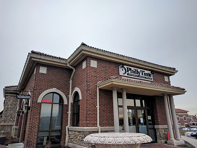 The stately brick exterior of Philly Time stands like a temple to sandwich perfection, complete with columns that say "We take our cheesesteaks seriously."