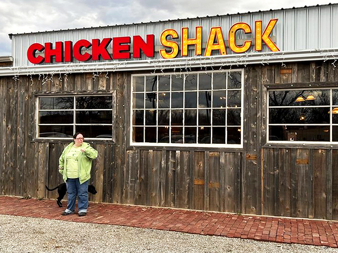 Route 66 nostalgia meets finger-lickin' reality at this weathered roadside gem. The red door practically winks at you, promising delicious secrets inside.