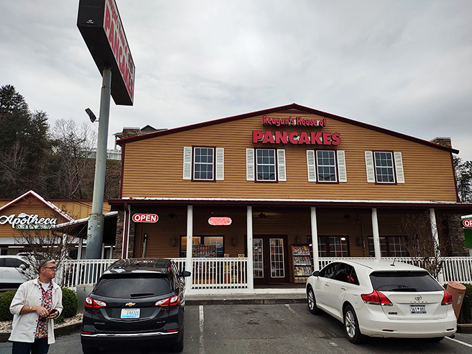 The honey-colored exterior of Reagan's House of Pancakes stands like a beacon of breakfast hope along Pigeon Forge's busy Parkway, promising carb-loaded bliss within.