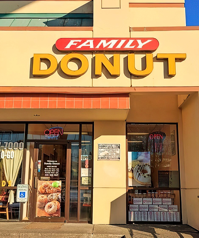 The yellow "DONUT" sign beckons like a lighthouse guiding sugar-seeking ships through morning fog. This unassuming storefront holds Seattle's sweetest treasures. 